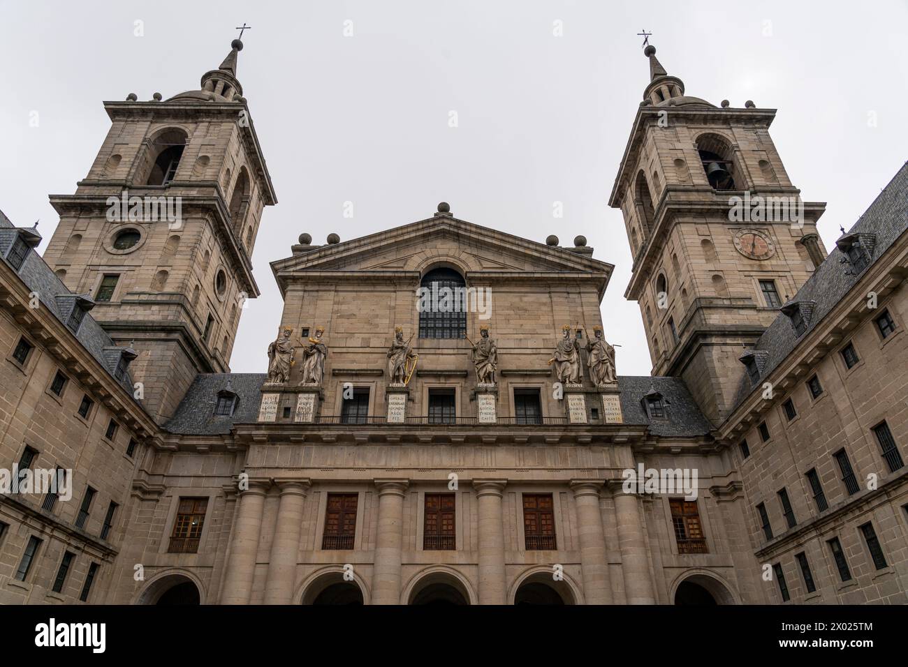Statues of historical figures stand over the main courtyard of El ...