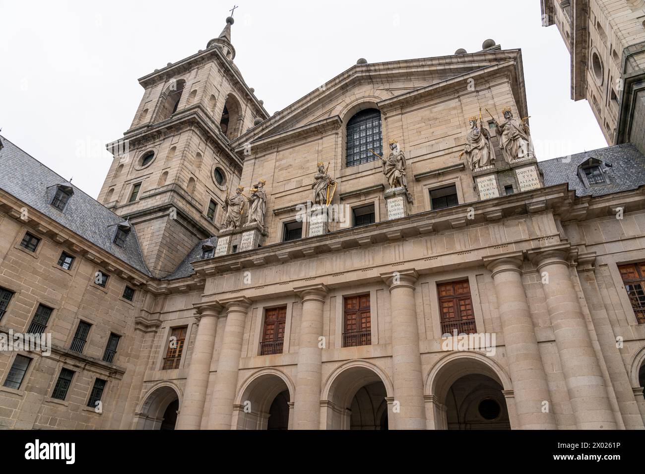 Statues of historical figures stand over the main courtyard of El ...