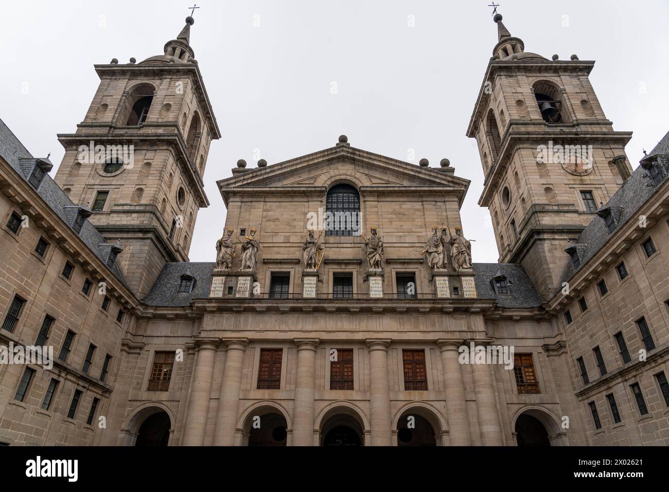 Statues of historical figures stand over the main courtyard of El ...