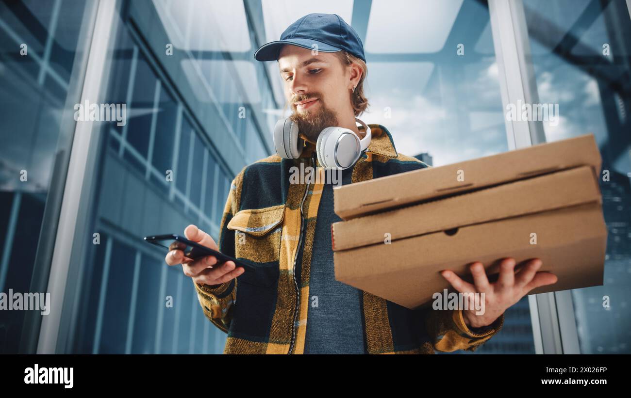 Young Food Delivery Person Riding Glass Elevator in Modern Office ...