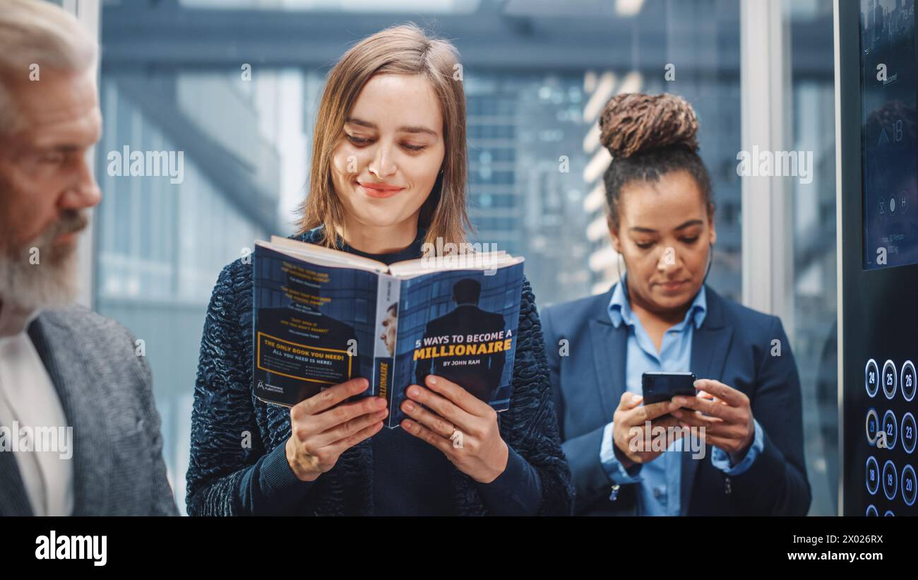 Female riding elevator reading book hi-res stock photography and images ...