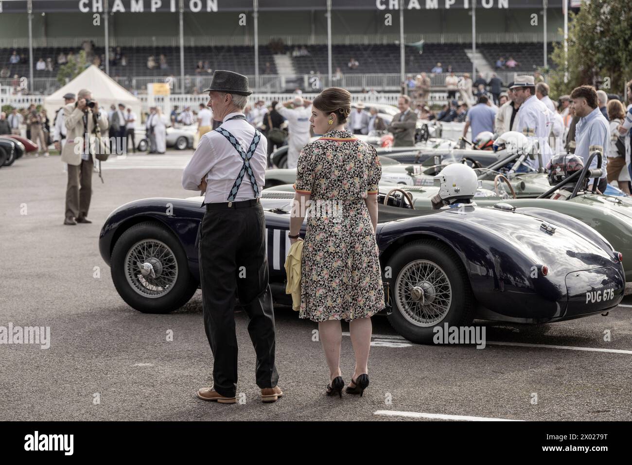 Period dress and historic racing cars assembled in the holding paddock prior to the Freddie ...