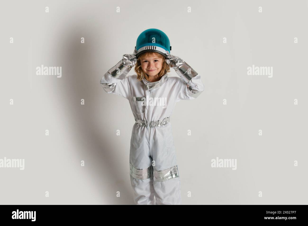 Little boy wearing an astronaut helmet costume and. Cute kid in ...