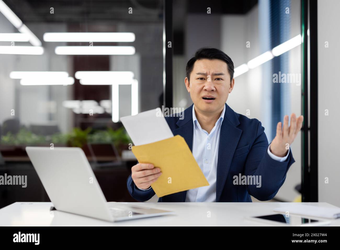 Confused man spreading hands hi-res stock photography and images - Alamy