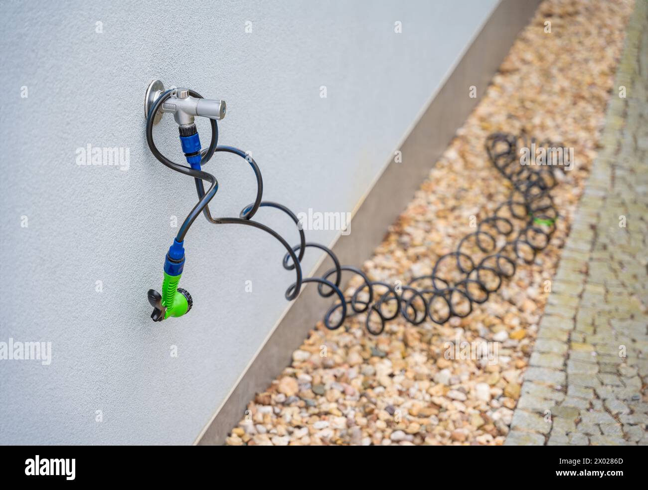 Blue green garden hoses hi-res stock photography and images - Alamy