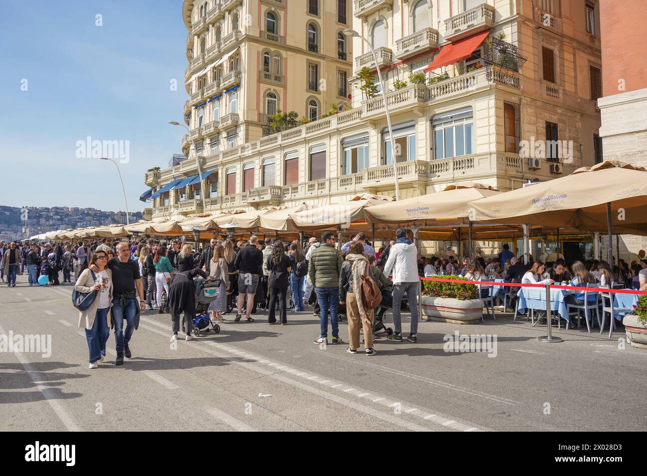 People walking on a saturday afternoon along the waterfront promenade ...