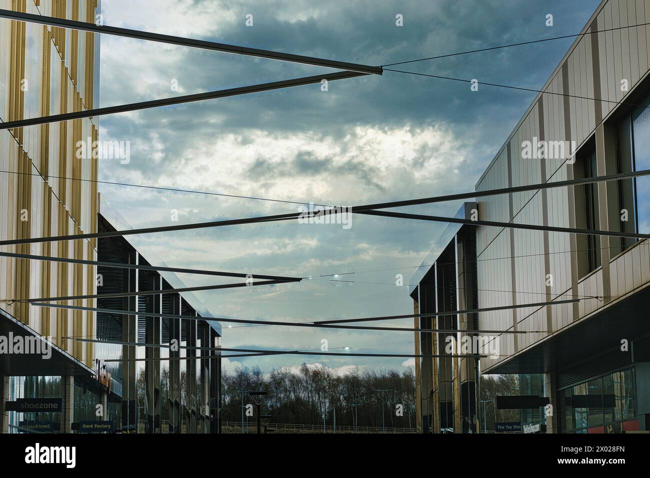 Modern architecture with geometric metal structures against a dramatic ...