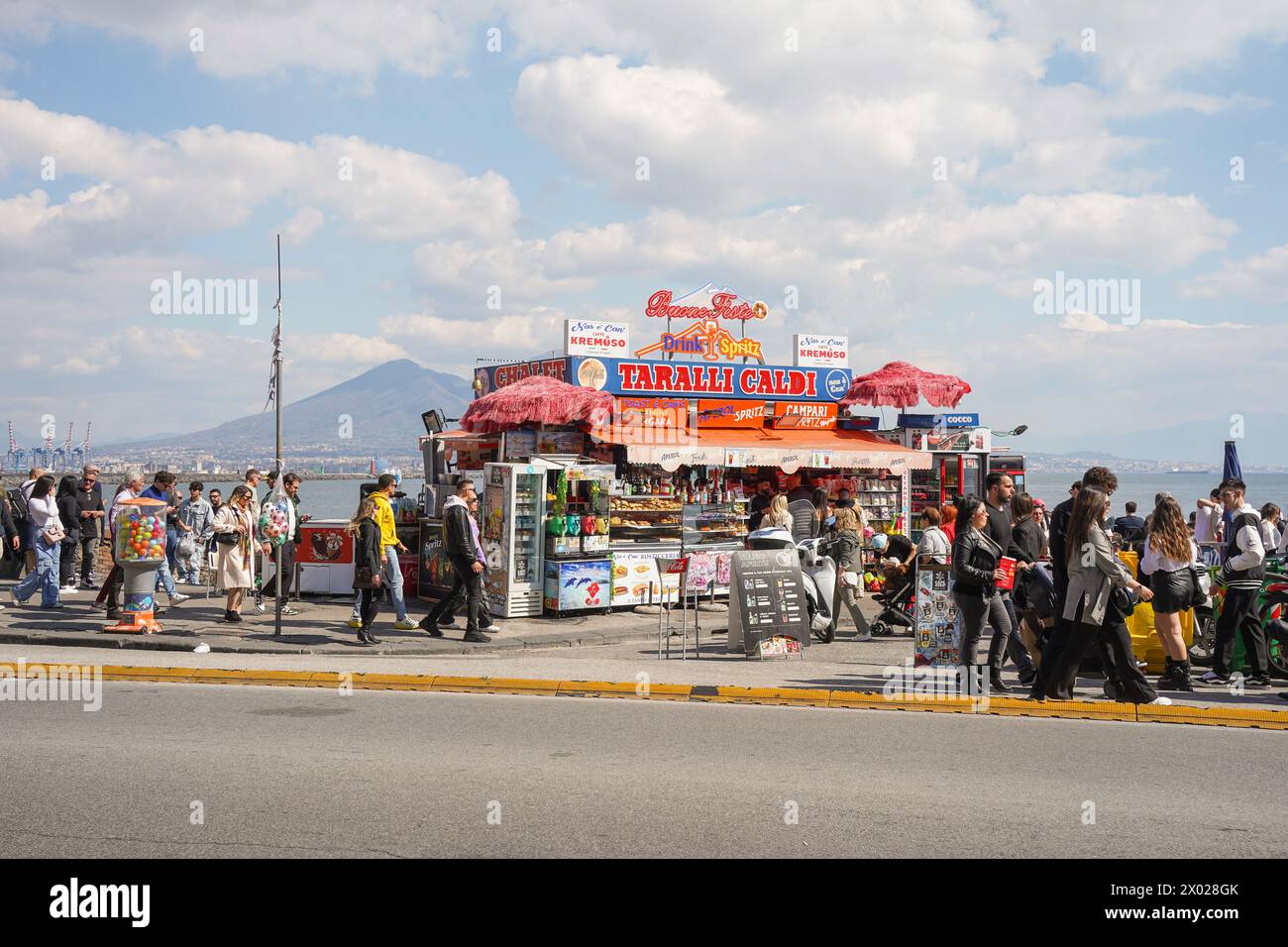 People walking along the waterfront promenade, Kiosk at Via Partenope ...