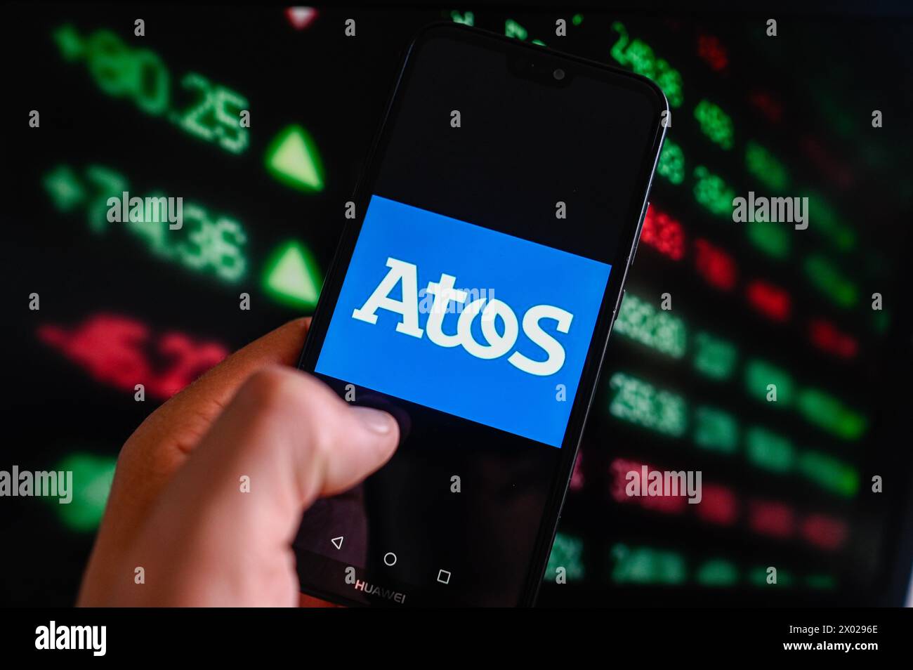 In this photo illustration, an Atos logo is displayed on a smartphone ...