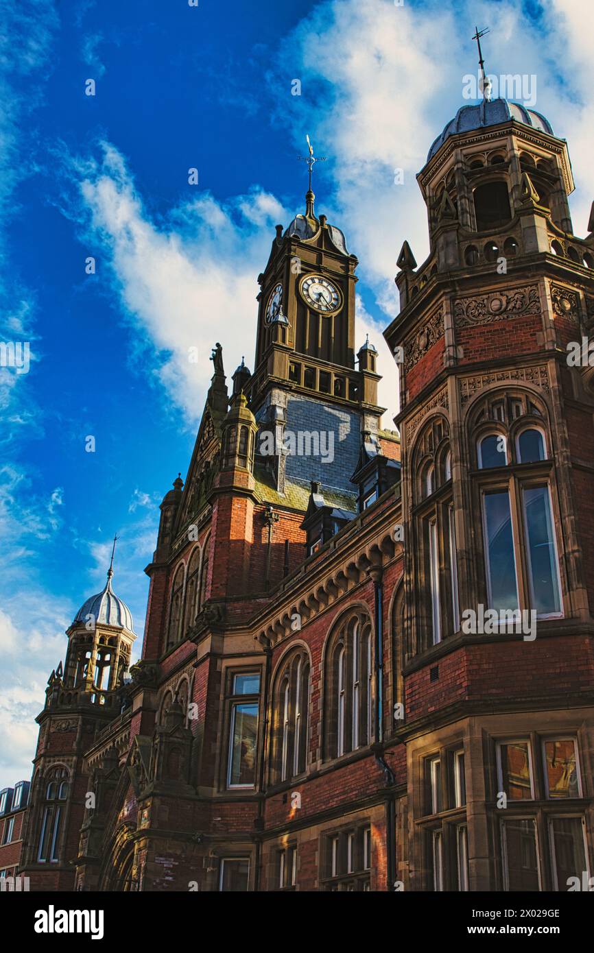 Gothic architecture of a historic building with a prominent clock tower ...