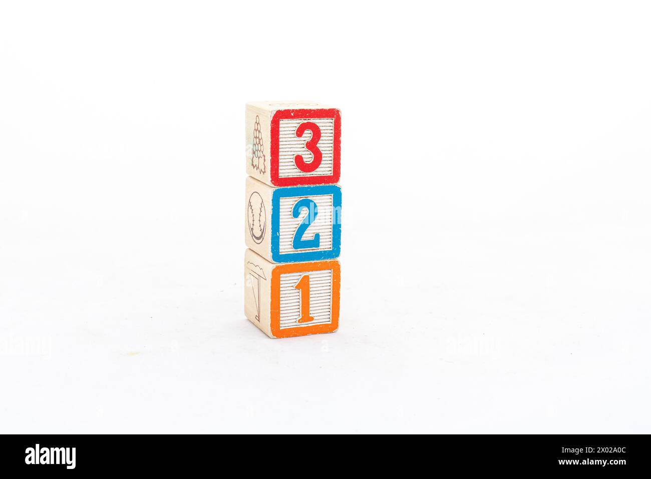 Stacked wooden cubes with numbers three, two, and one isolated on a ...