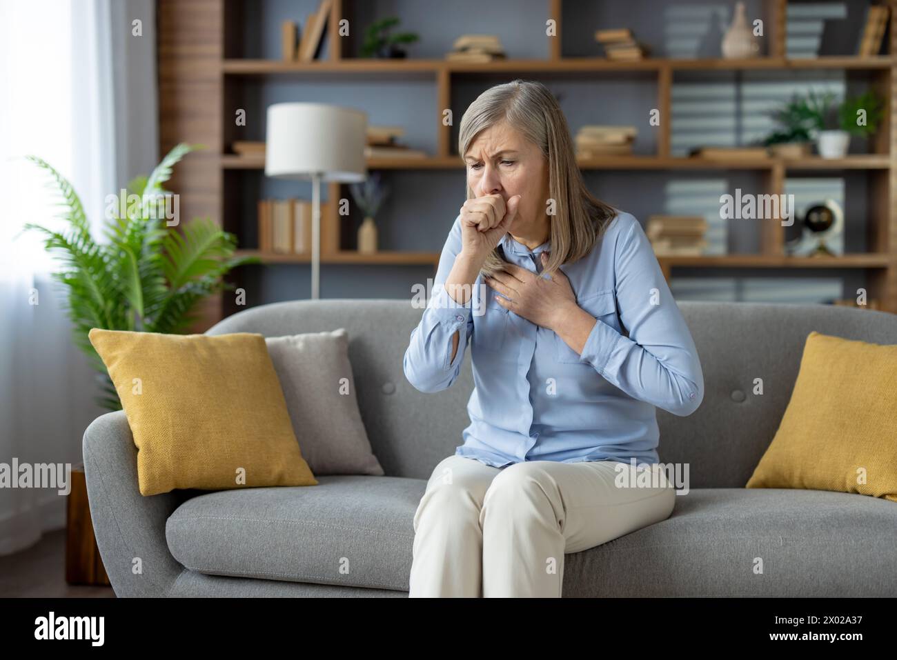 Clenched fist to chest hi-res stock photography and images - Alamy