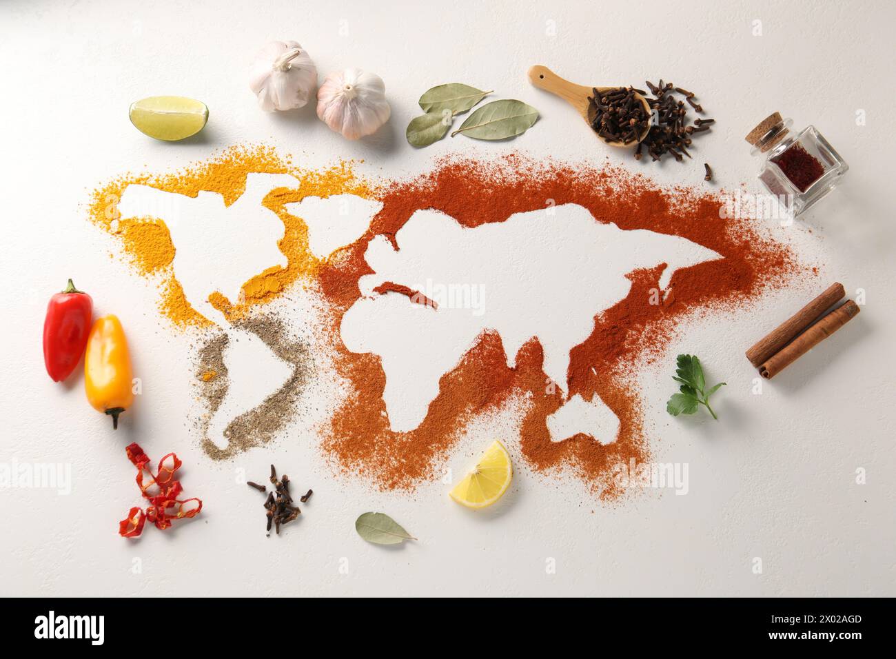World map of different spices and products on white textured table ...
