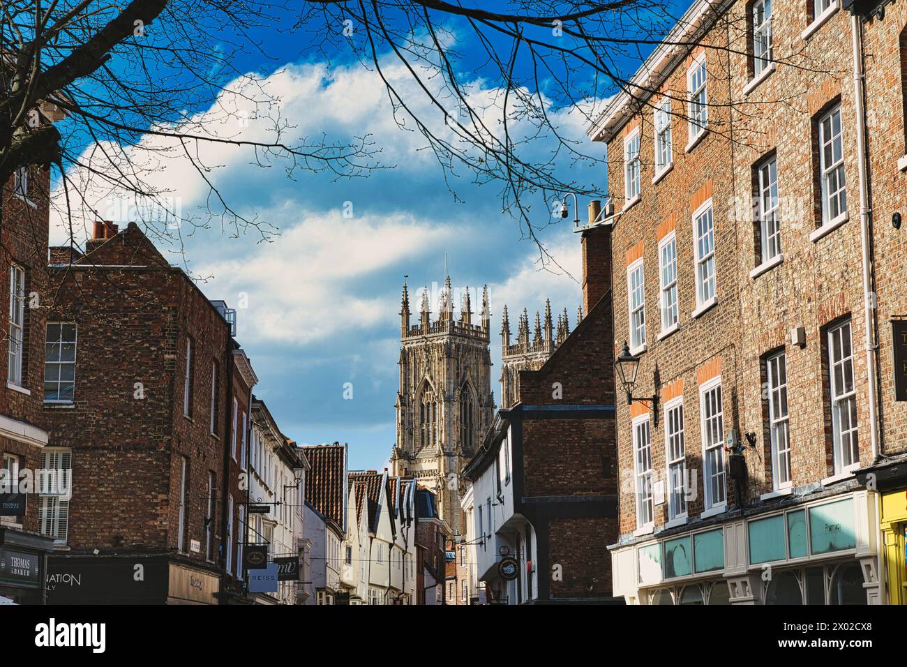 Historic European city street with traditional brick buildings and a ...