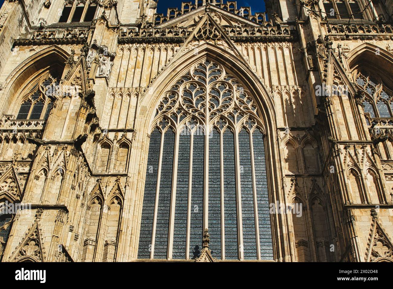 Gothic architecture detail of a cathedral's facade, featuring a large ...