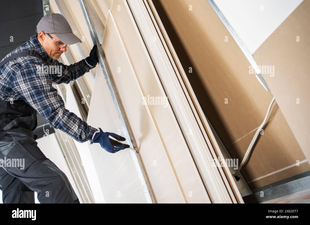 Construction Contractor Worker Marking Cutting Place on a Sheet of a ...