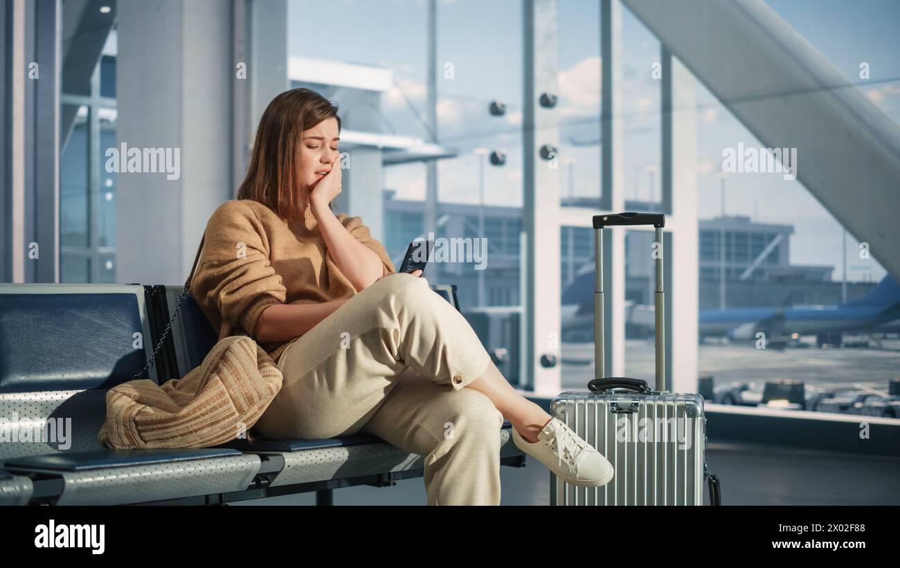 Airport Terminal: Woman Waits for Flight, Uses Smartphone, Receives Bad ...