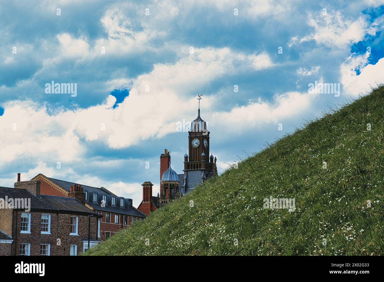 Quaint European town with historic buildings and a clock tower, set ...