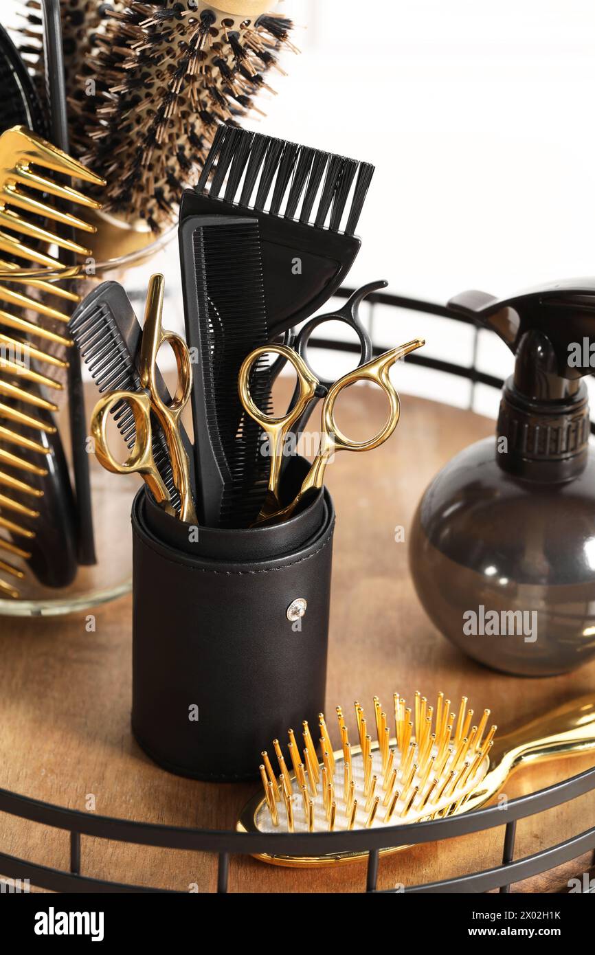 Set of hairdresser tools on table in salon Stock Photo - Alamy
