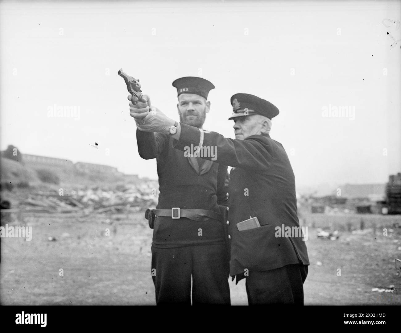 REVOLVER PRACTICE. 1940, NAVAL RATINGS RECEIVING REVOLVER INSTRUCTION ...
