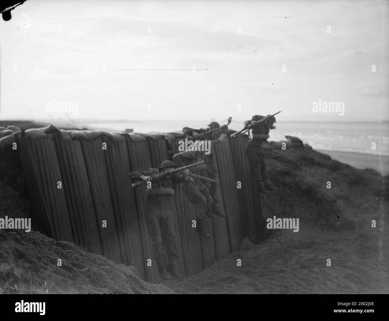 British commando troops at Dundonald Camp performed a 15-foot jump ...