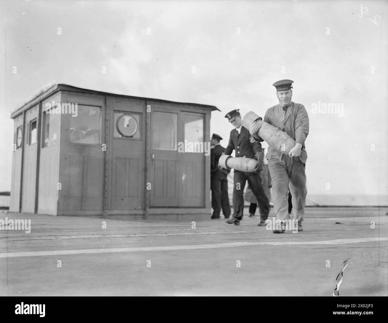 ON BOARD THE AIRCRAFT CARRIER HMS ARGUS. 1940. - 100 lbs anti-submarine ...