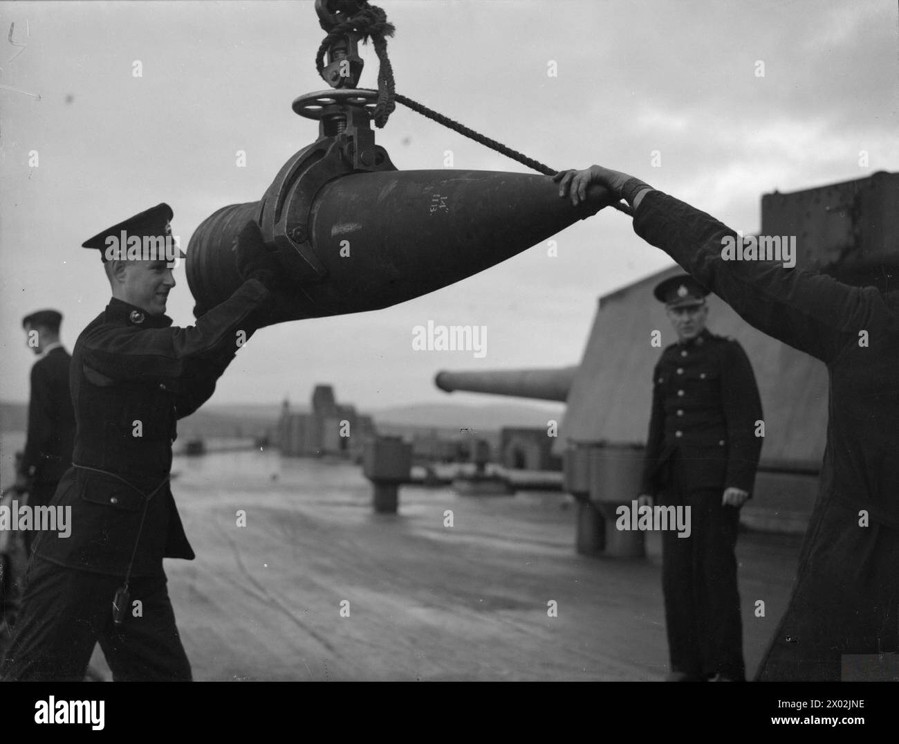 In 1941, HMS King George V received her ammunition quota in port, with ...