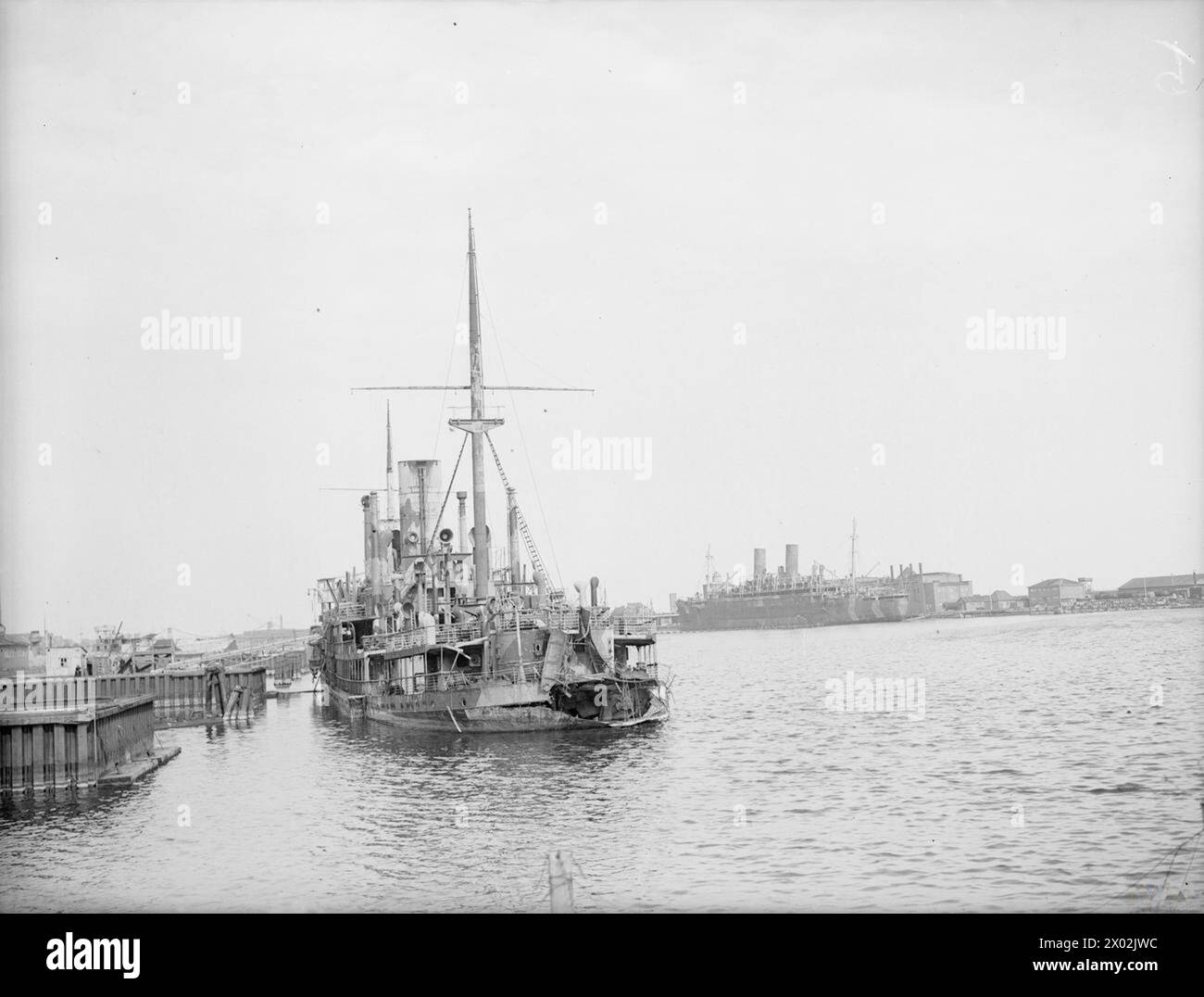 The German cruiser Köln and other vessels lie bomb-damaged at ...