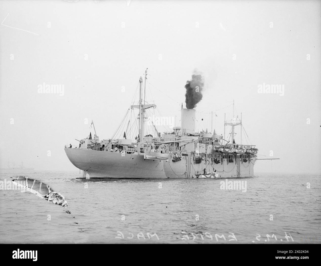 HMS Empire Mace, a large Landing Ship Infantry, is docked at Greenock ...
