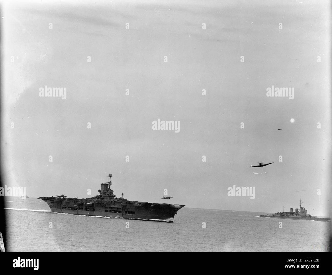 ON BOARD THE CRUISER HMS SHEFFIELD. MAY 1941, AT SEA. - Planes flying from HMS ARK ROYAL Royal ...