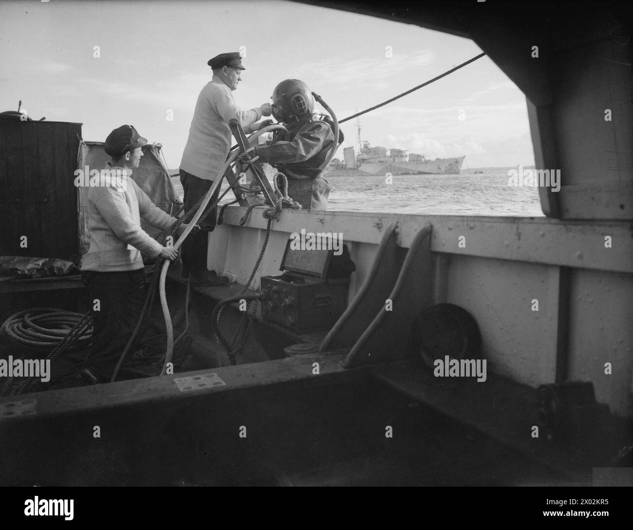 A diver from HMS Tyne, a destroyer depot ship, performs an underwater ...