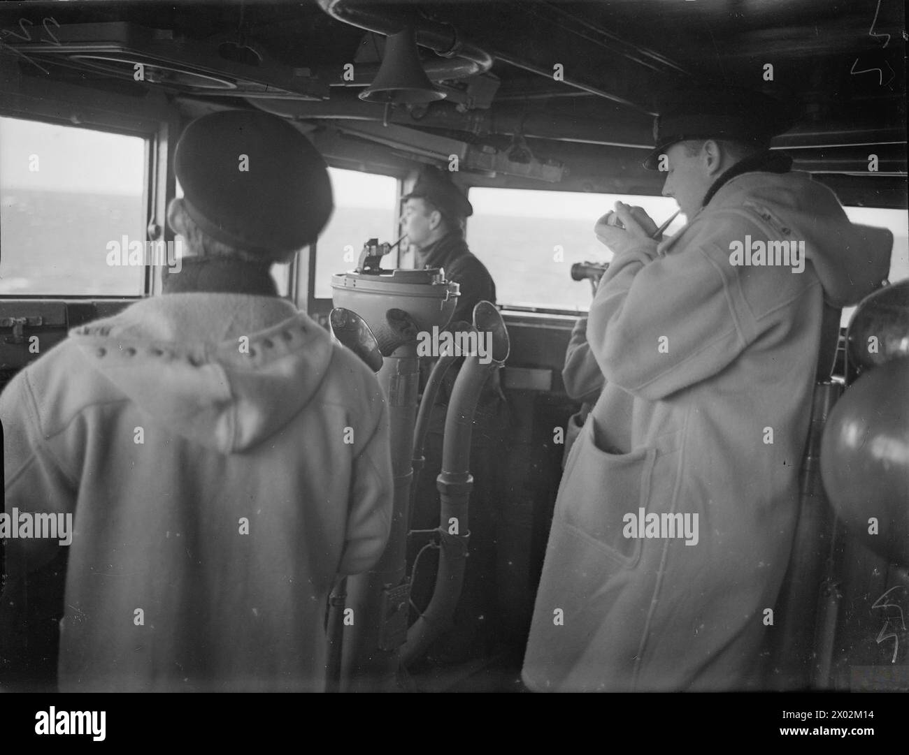 ON BOARD THE BATTLESHIP HMS RODNEY AT SEA. 1940. - On the bridge. The ...