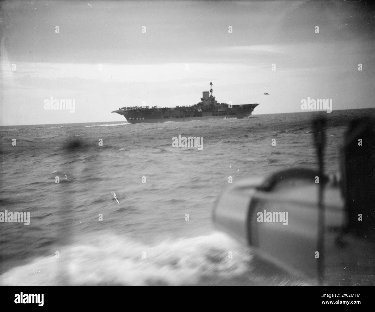 ON BOARD THE CRUISER HMS SHEFFIELD. APRIL 1941. - Hurricanes being flown from HMS ARK ROYAL ...