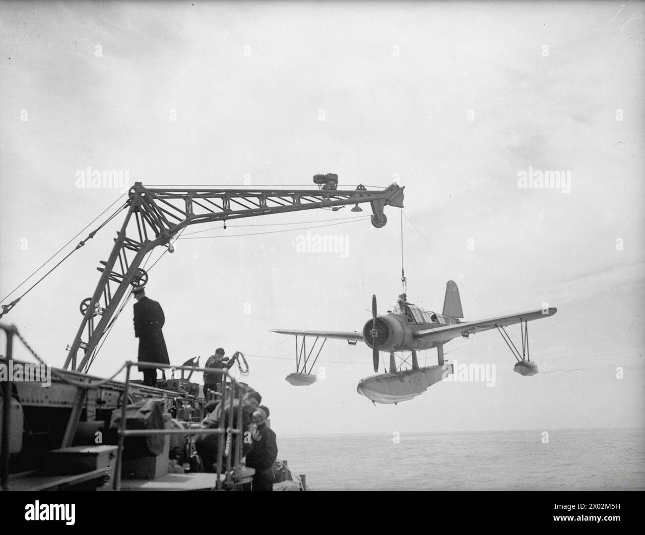 AMERICAN BATTLESHIP RETRIEVING HER AIRCRAFT. JUNE 1943, SCAPA FLOW, ON ...