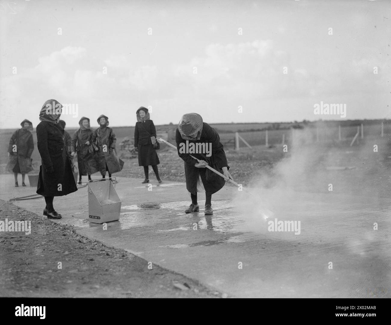 WRNS personnel at a Fleet Air Arm station in 1940 finish a bomb using ...