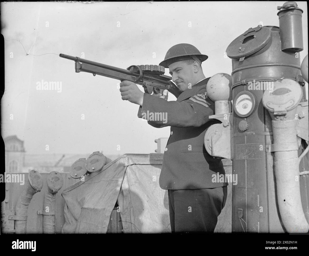 Yeoman of Signals Douglas Brook from Weybridge handles a stripped Lewis ...