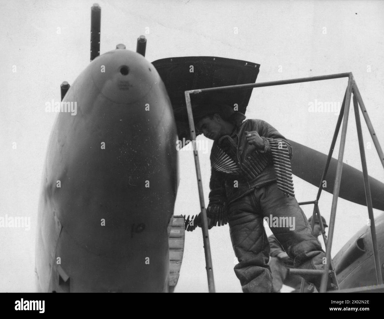 Sergeant William Dehart, armorer with the 55th Fighter Group of the US ...