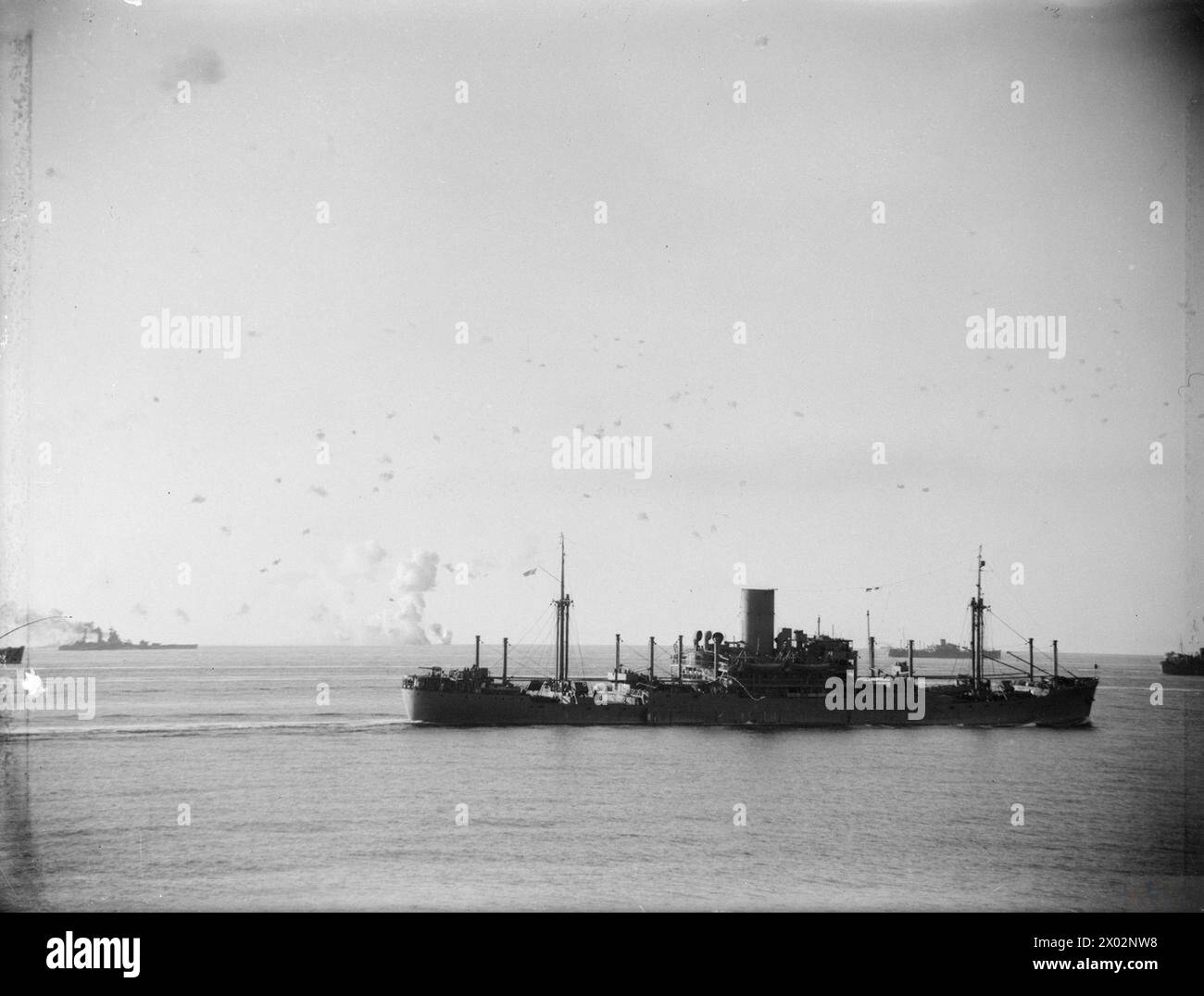 A CONVOY TO MALTA. 5-13 AUGUST 1942. - HMS INDOMITABLE is hit by a dive ...