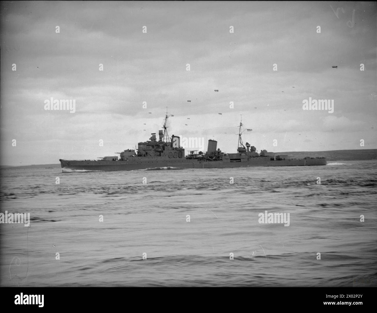 HMS Manchester, a cruiser of the Royal Navy, is seen leaving Scapa ...