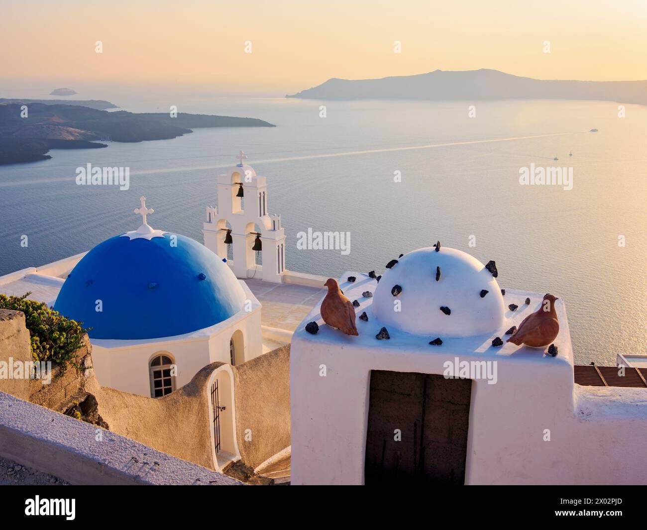 Three Bells of Fira, iconic blue domed church at sunset, Fira ...