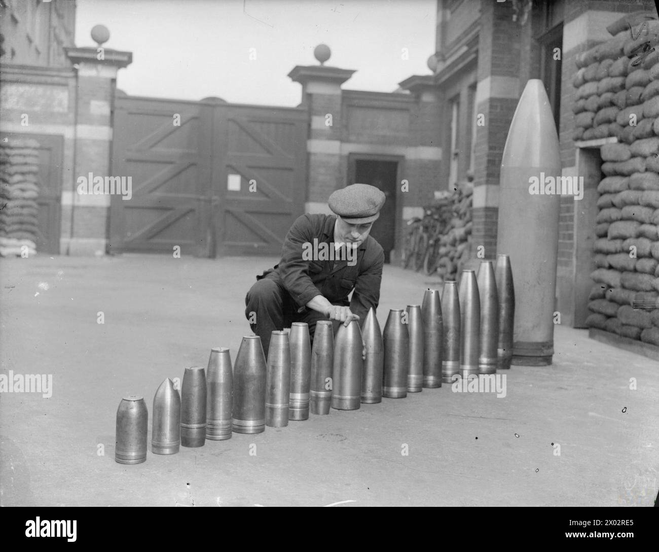AT WORK IN A BRITISH SHELL FACTORY, ENGLAND, C 1940 - A munitions ...