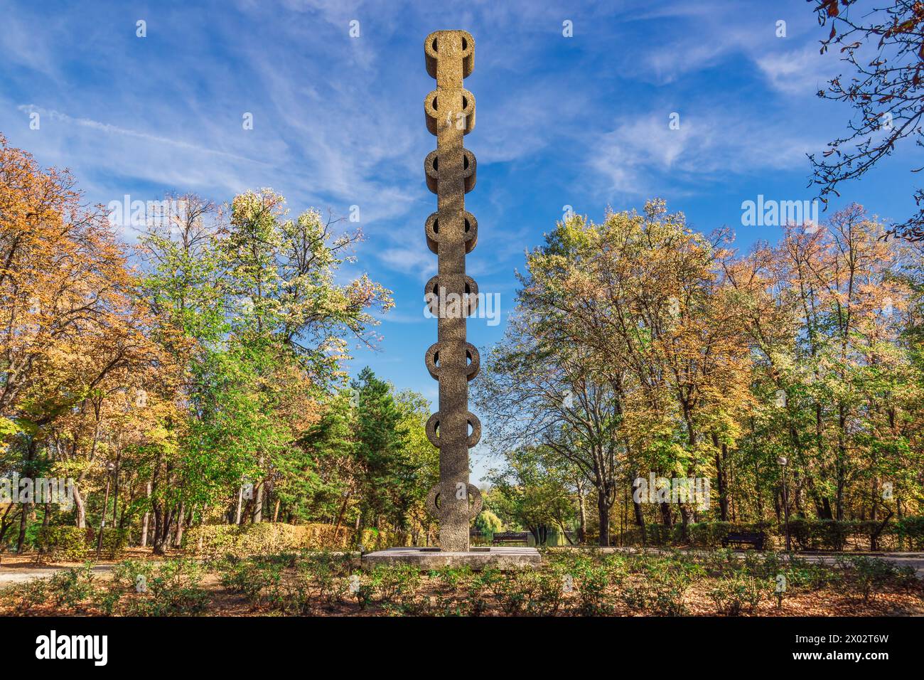 Coloana monument (Coloana Comemorativa) surrounded by greenery at a ...