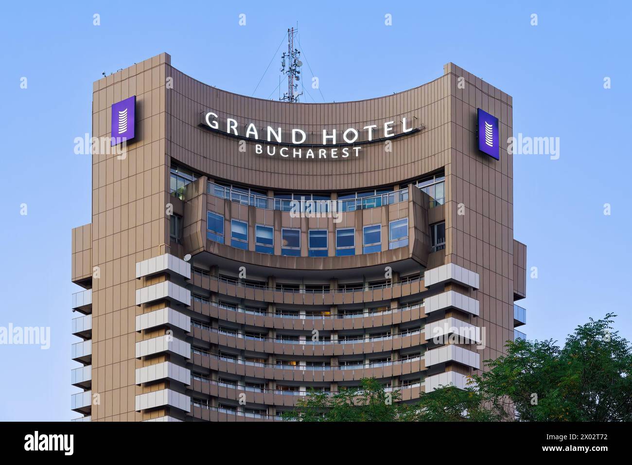 Low angle view of Grand Hotel Bucharest skyscraper with logo, under a ...