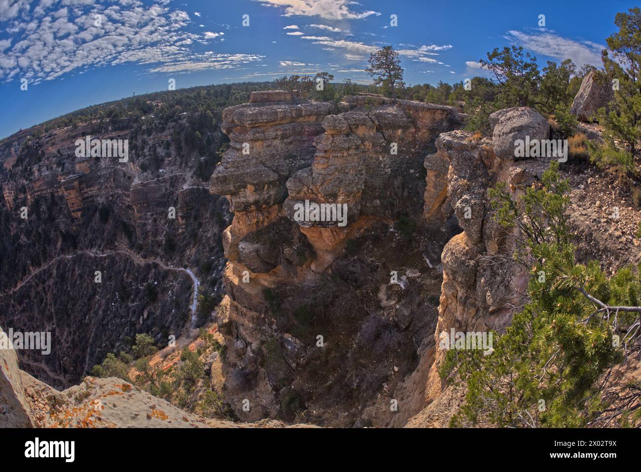 An outcrop of rock overlooking the Bright Angel Trail below at Grand ...