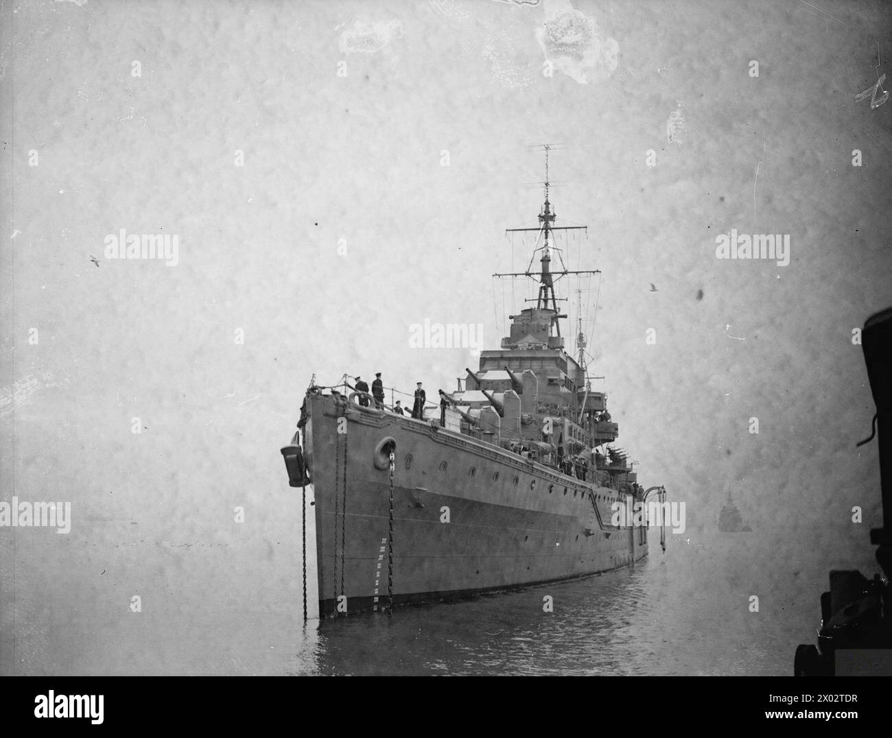 HMS Bonaventure, a Dido-class light cruiser of the Royal Navy, is shown ...
