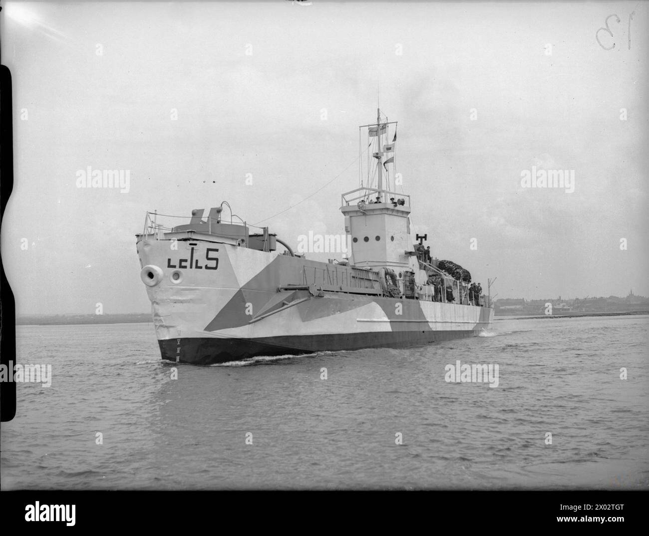 Landing Craft (Infantry) LCI 5 moves at speed near a Combined ...