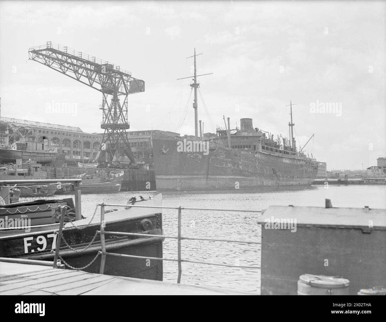 WRECKAGE IN THE BOMB-SCARRED HAMBURG DOCKS. 8 JULY 1945, WRECKED AND ...