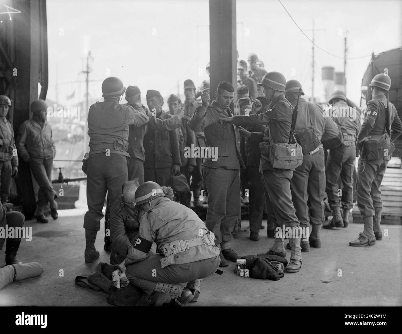 German prisoners of war captured in France on 18 June 1944 arrive at a ...