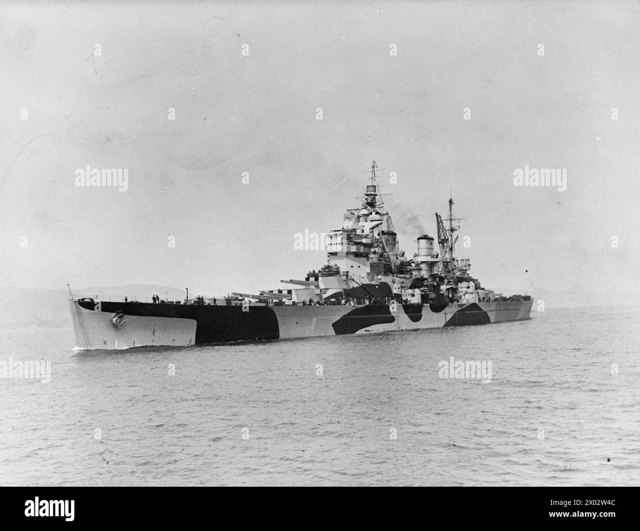 HMS Howe, a British warship of the Second World War, is shown on ...