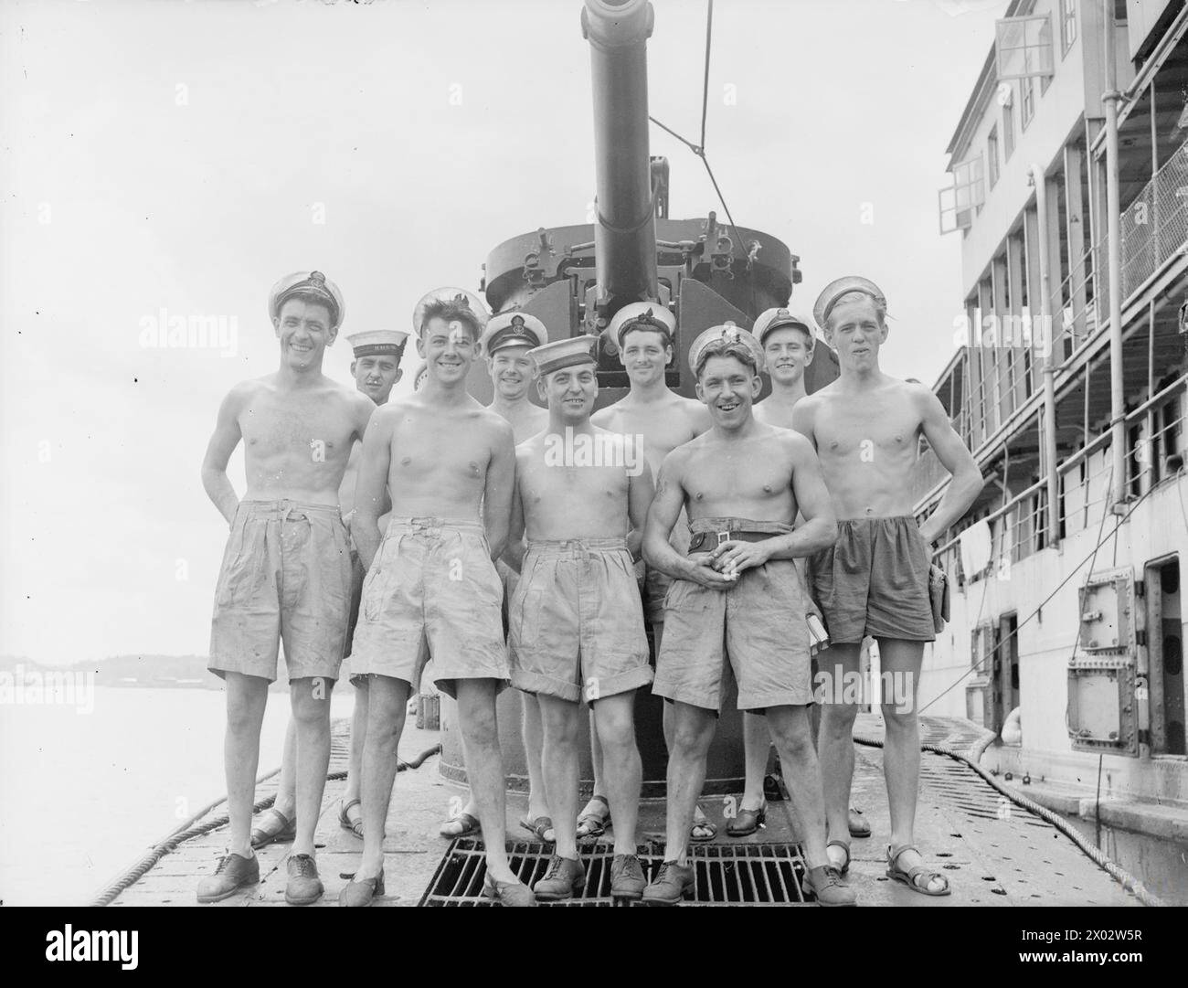 Officers and crew of HMS/M Trident are shown in a group photograph on ...